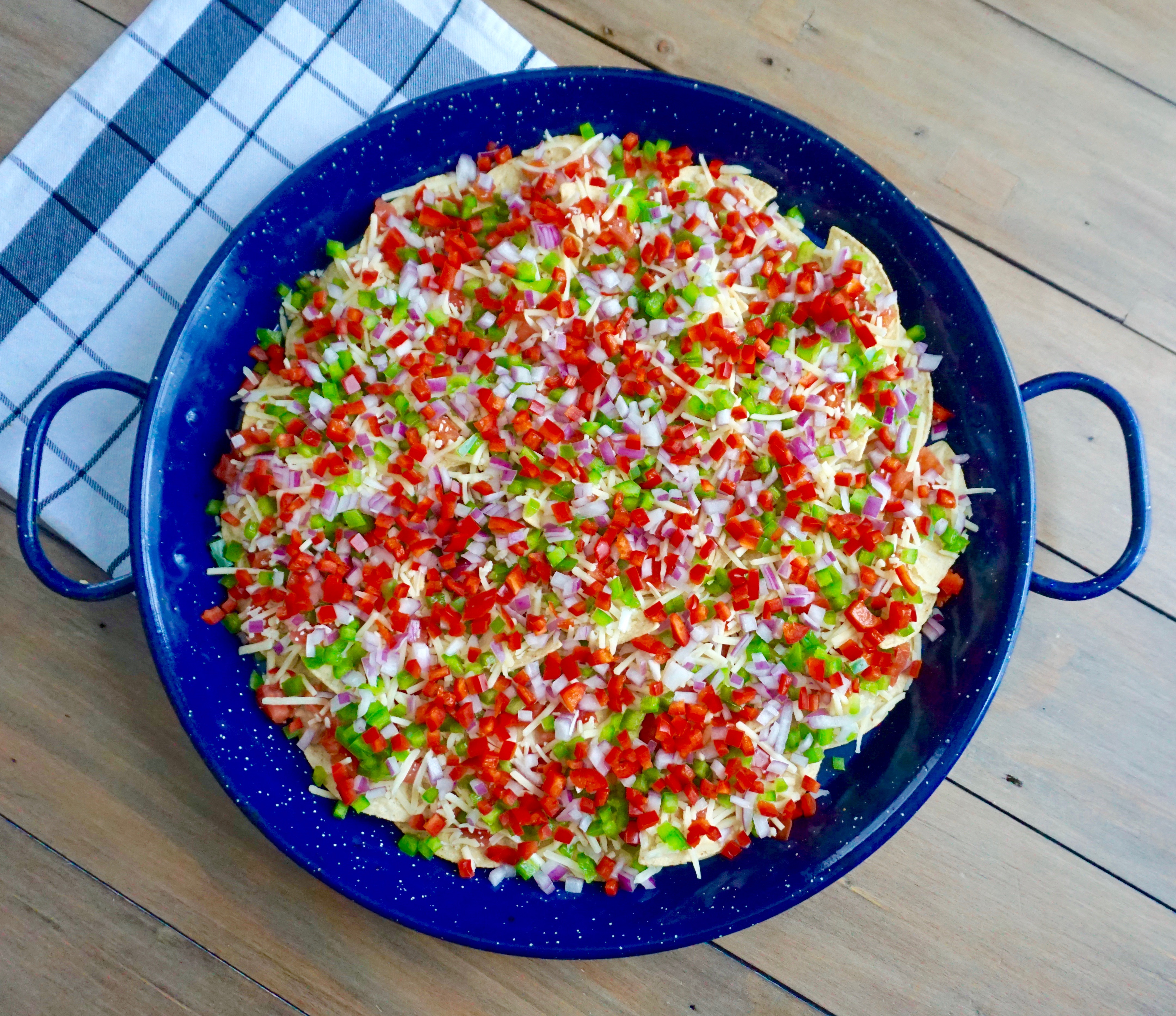 Vegetable Nachos are cheesy, fresh, vegetarian nachos